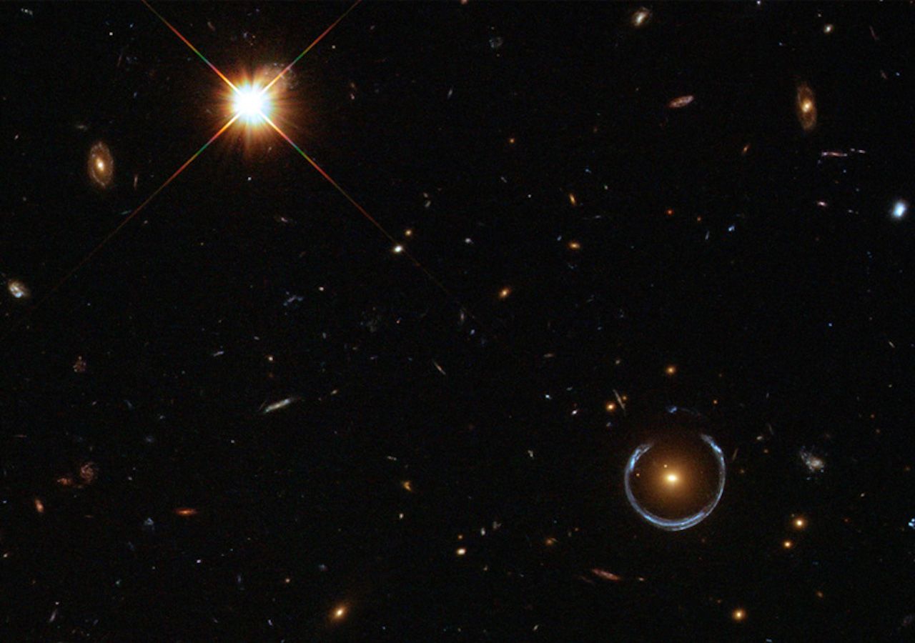 Hubbles Einstein Cross Marks The Spacewarping Spot